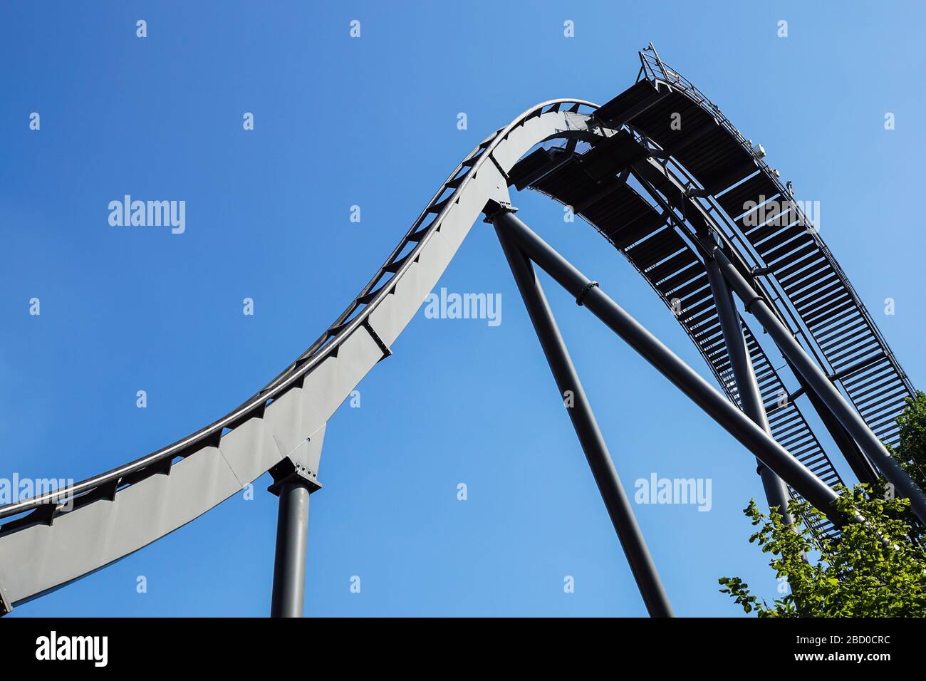 Rollercoaster track against a brilliant blue sky Stock Photo - Alamy