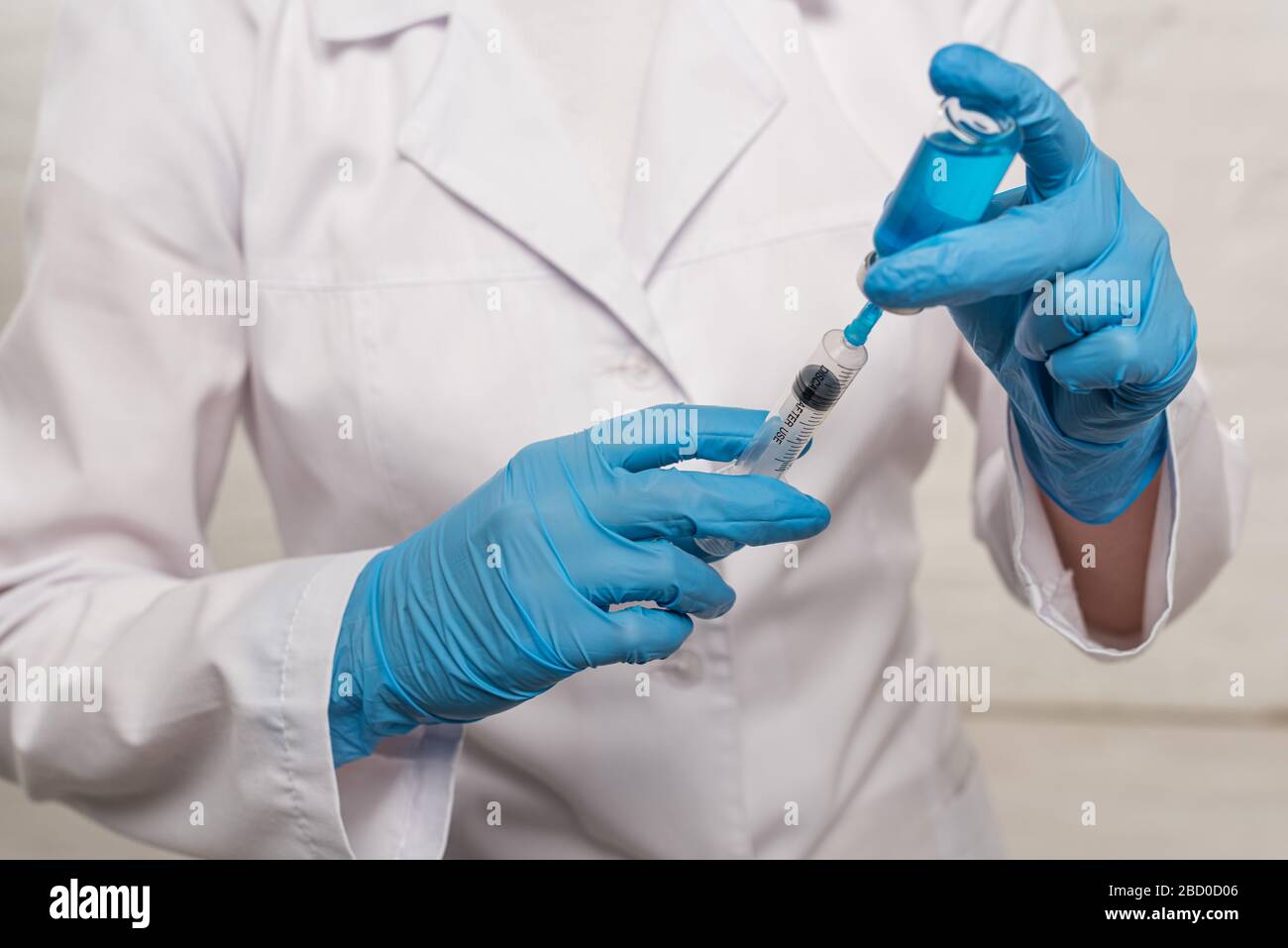 Woman picking medicine syringe hi-res stock photography and images - Alamy