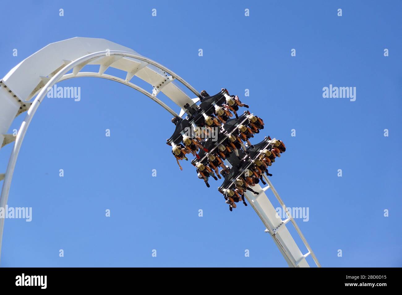 Roller coaster twisting upside down . Twist and turns of a modern steel ...