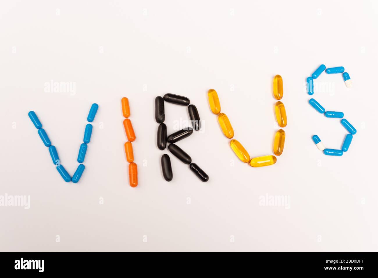 Top view of virus lettering from pills on white background Stock Photo ...