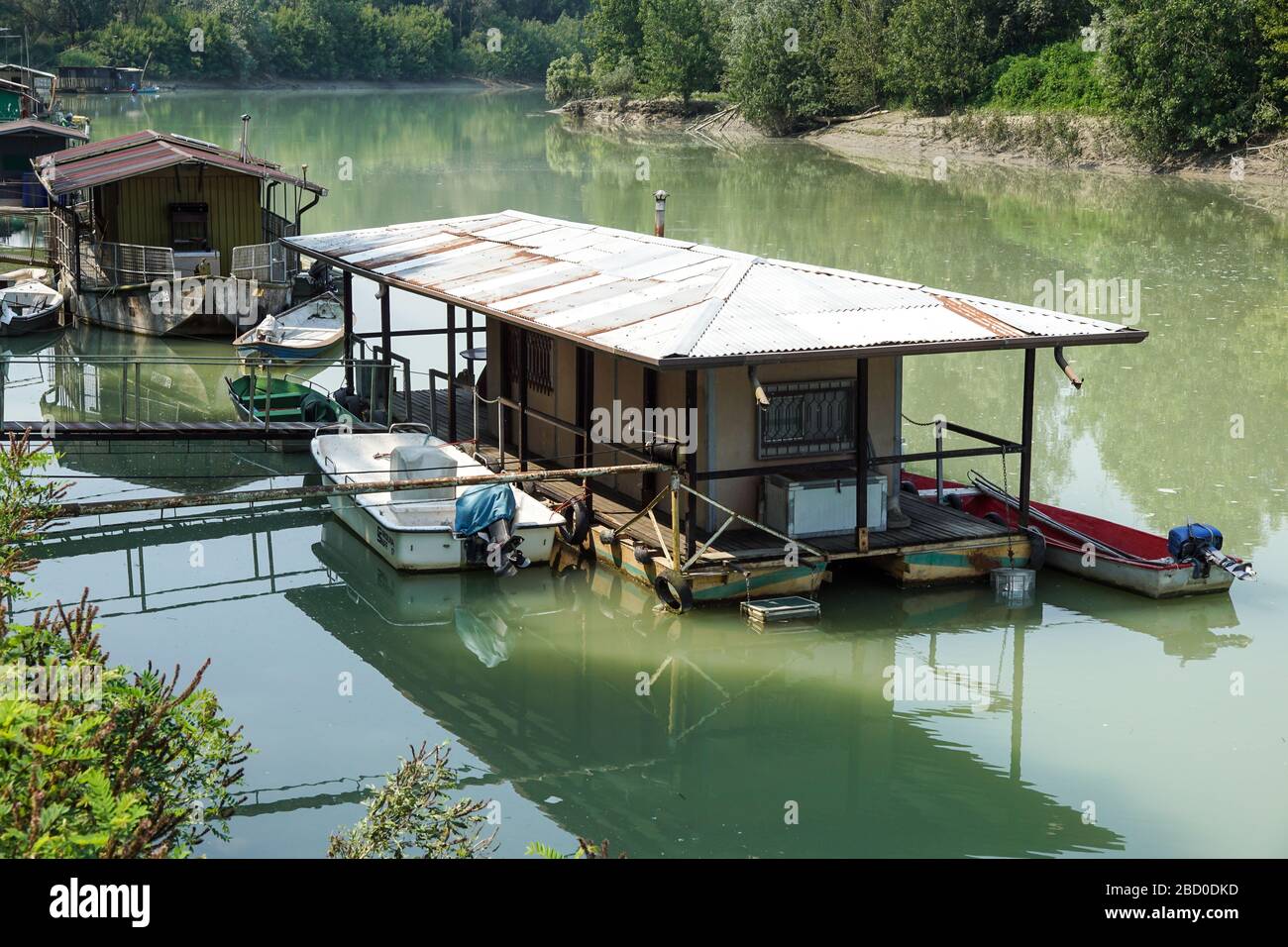 houseboat parked by the river near the swamp Stock Photo - Alamy