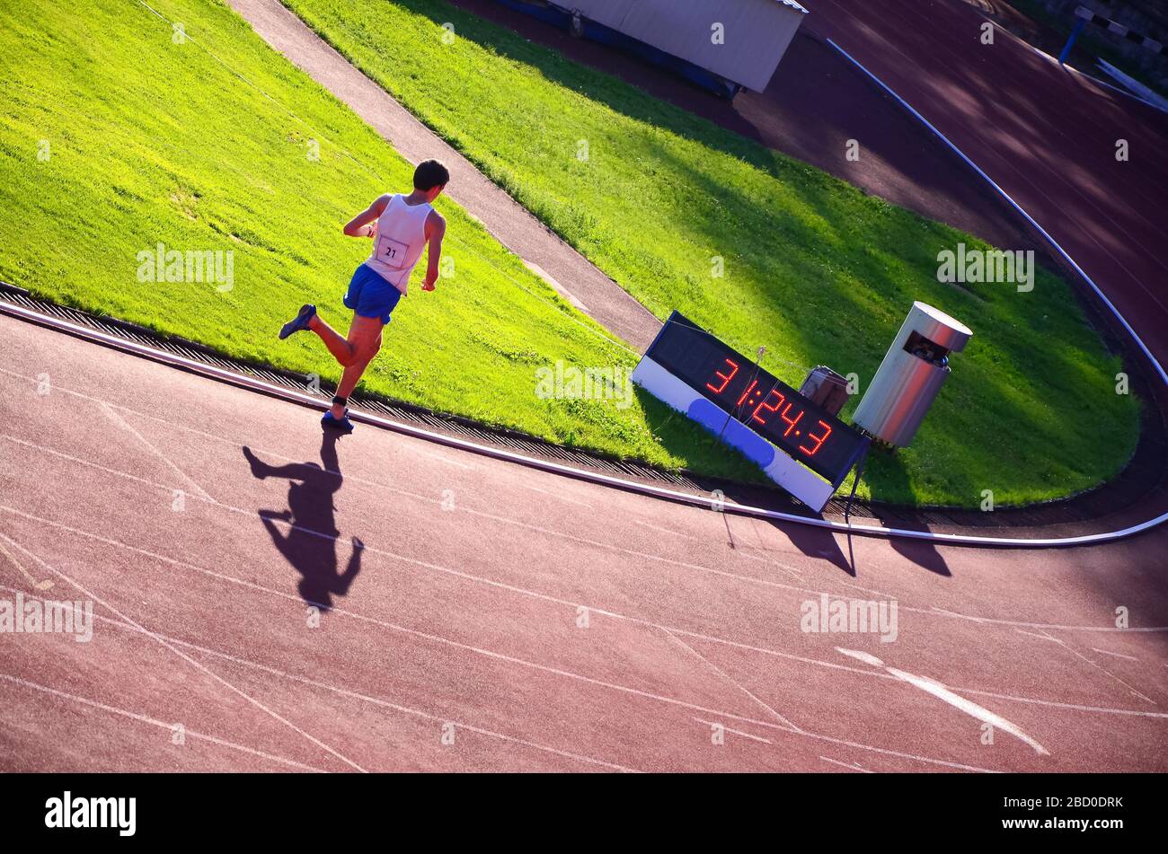 Athlete run on track during race Stock Photo - Alamy