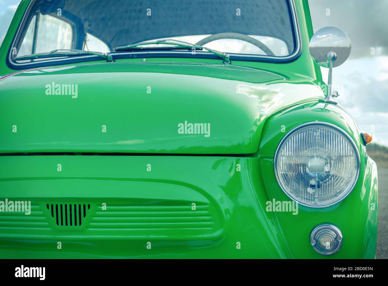 green little retro car. retro car concept. view of the front of the car ...