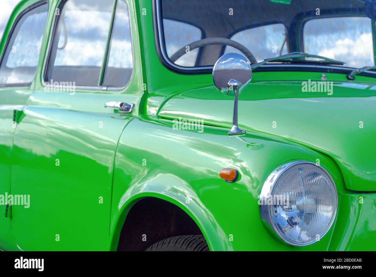 Vintage retro car. small soviet retro car of green color against the ...