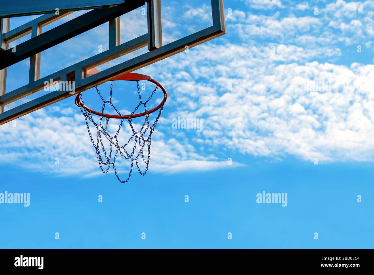 outdoor basketball game concept. basketball net against the blue sky ...
