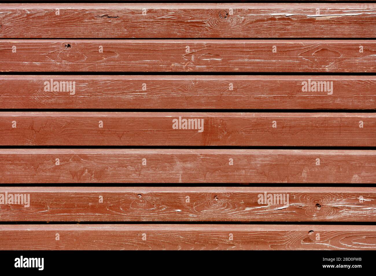 Brown old paint on an eroded shabby wooden horizontal wooden battens ...