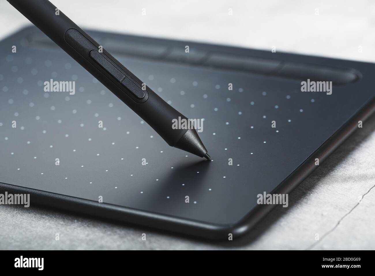 Graphic tablet with a pen working designer, close-up. Gadget for ...