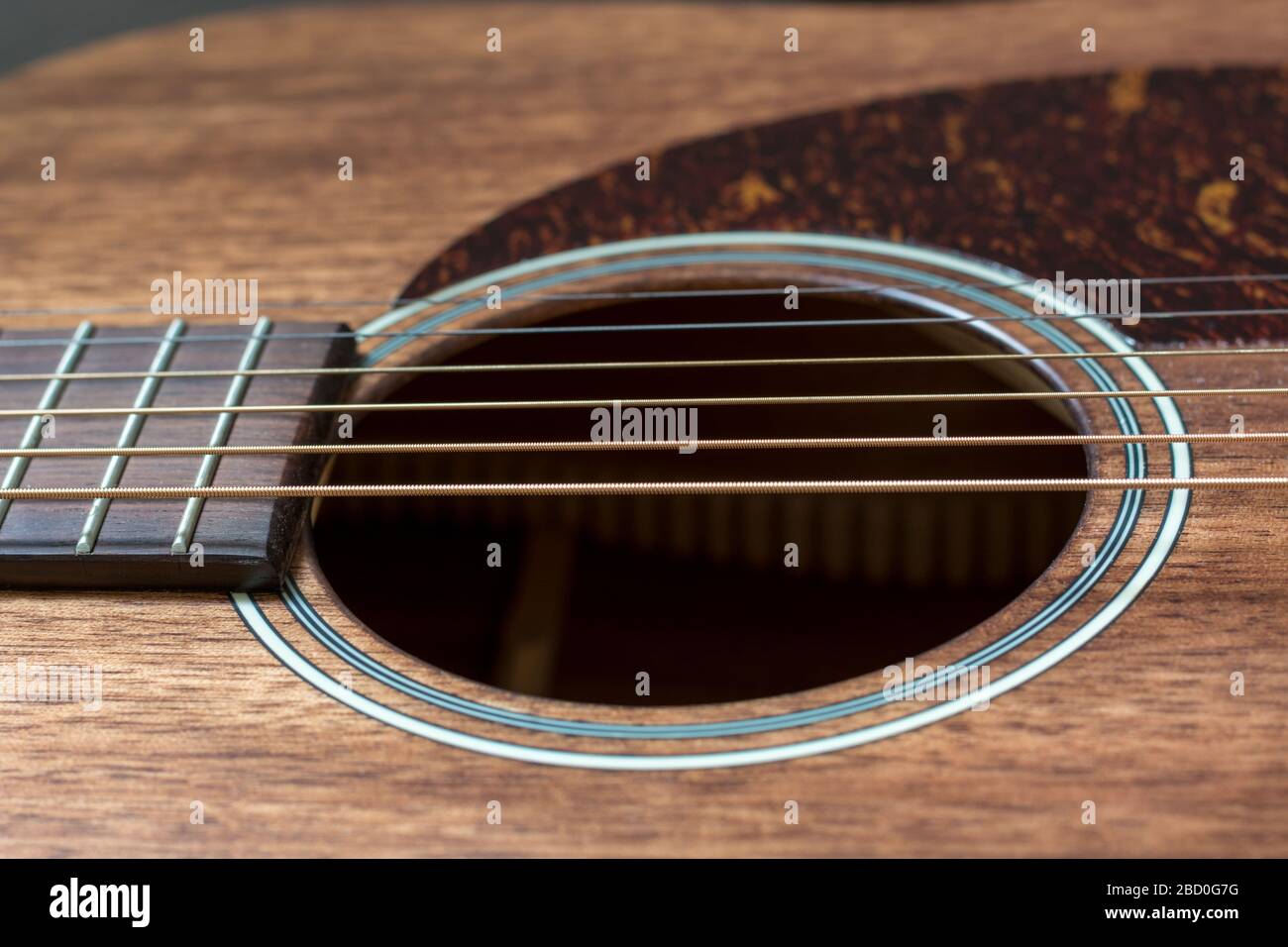 A detail of a classic wooden guitar with strings hi-res stock ...