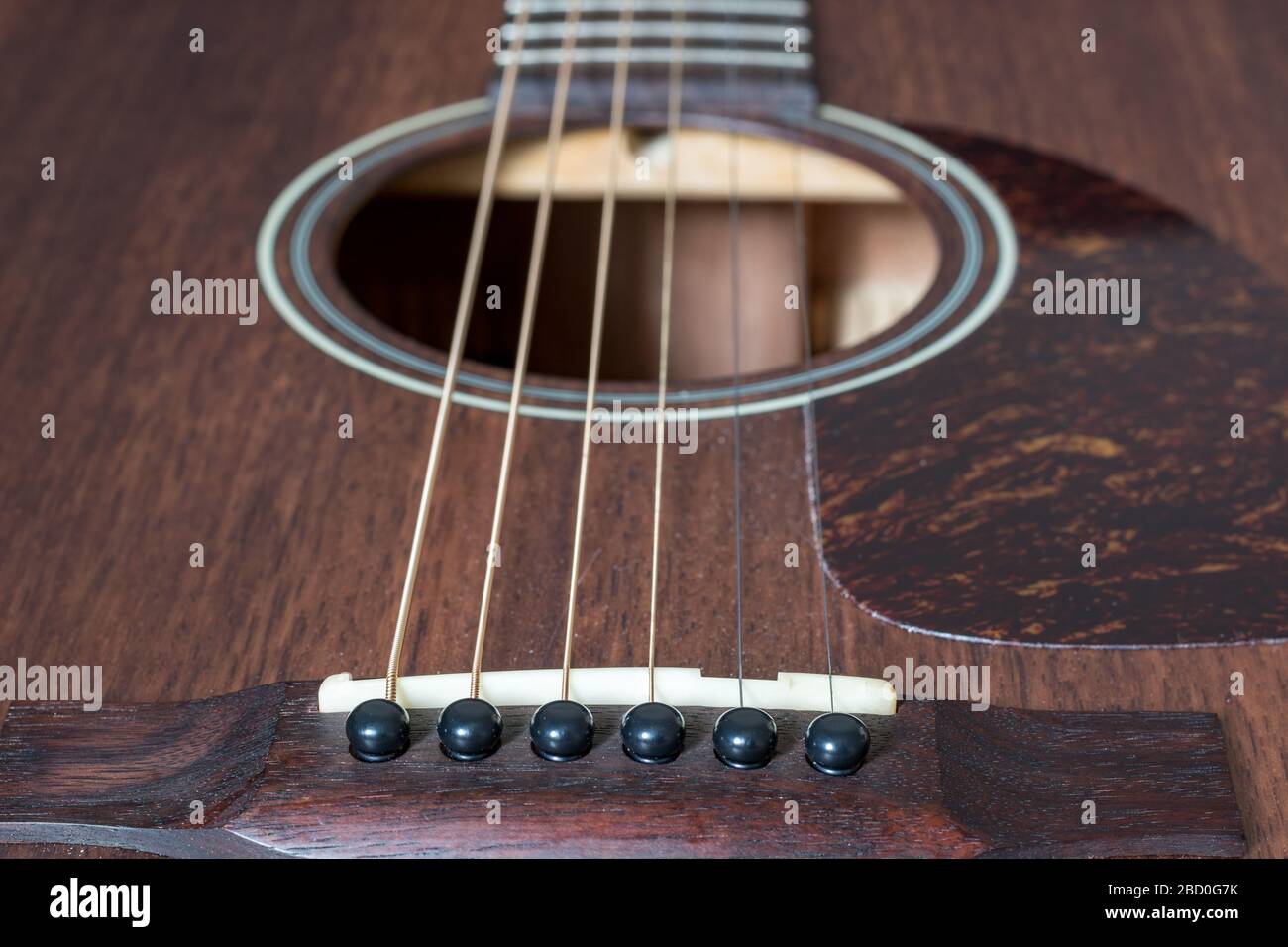 A detail of a classic wooden guitar with strings hi-res stock ...