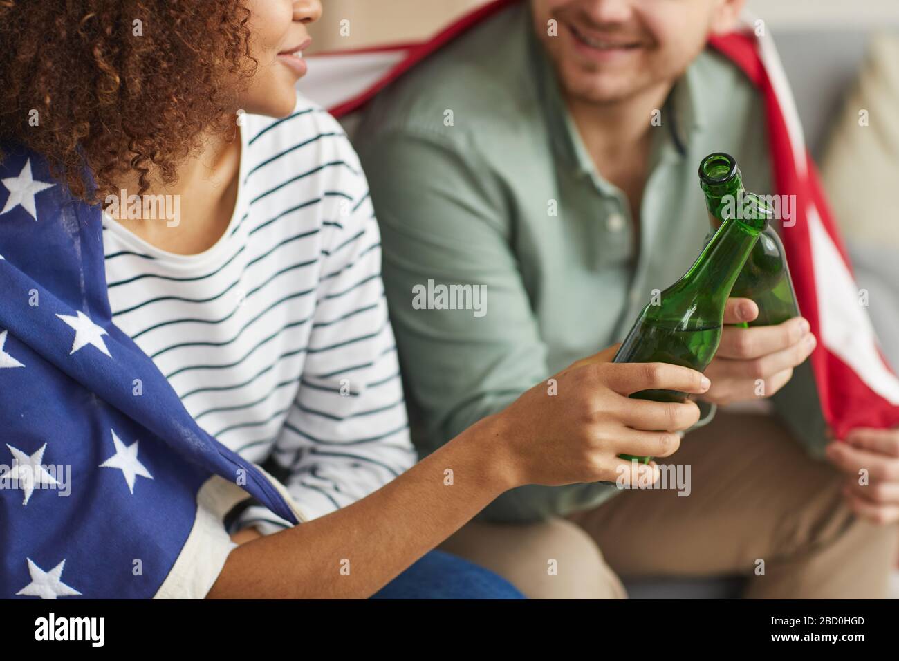 Couple clinking bottles hi-res stock photography and images - Alamy