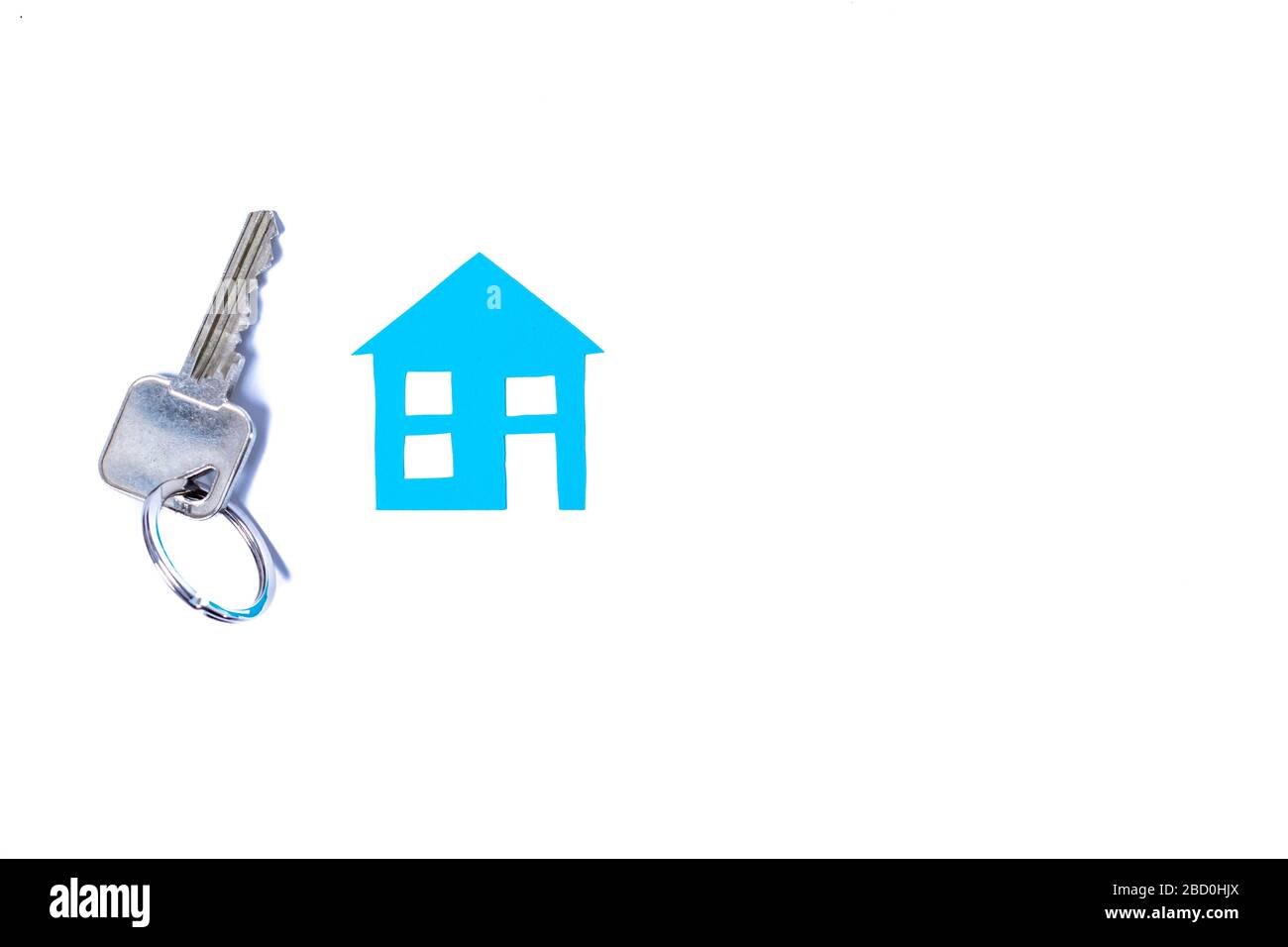 A blue house and keys isolated on a white background Stock Photo - Alamy