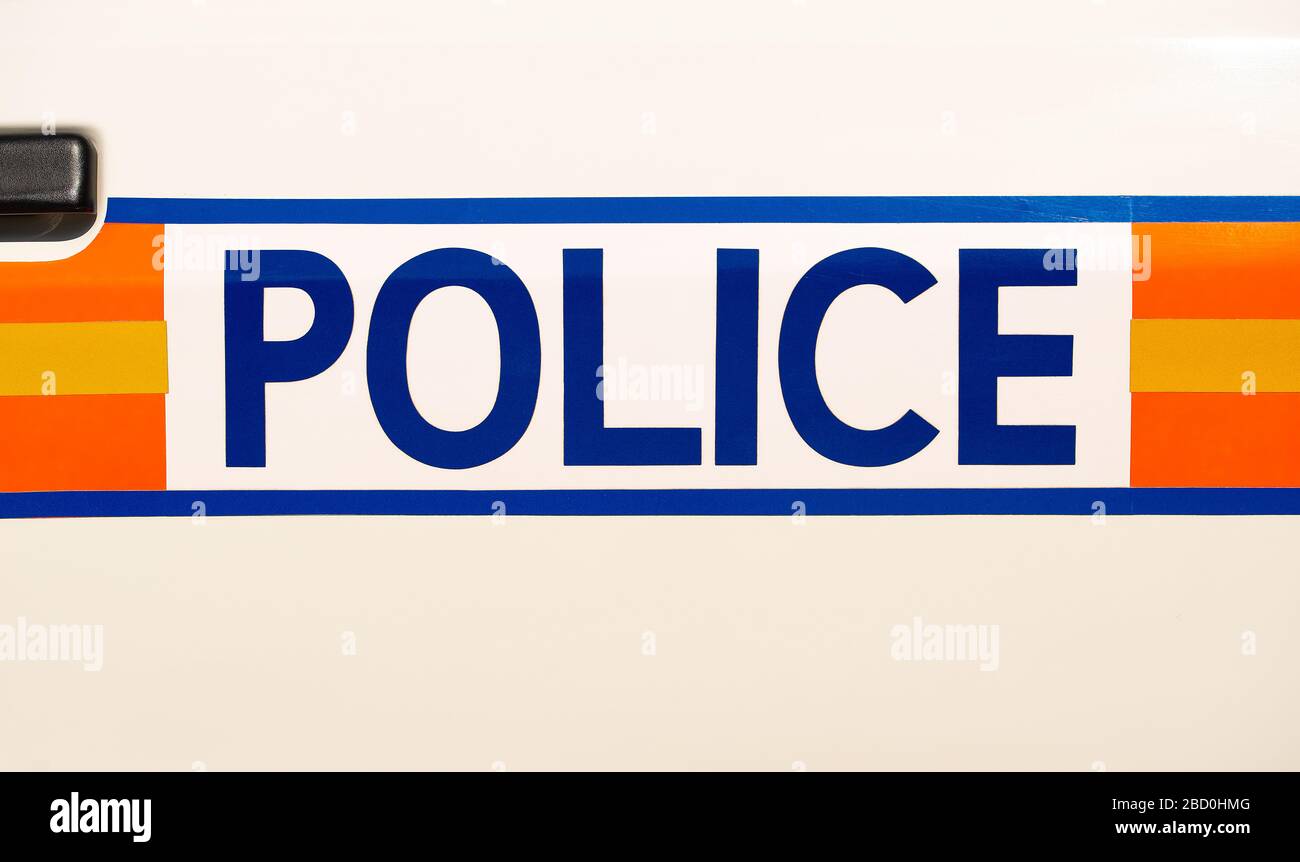 Large POLICE sign on the side door of an emergency response patrol ...