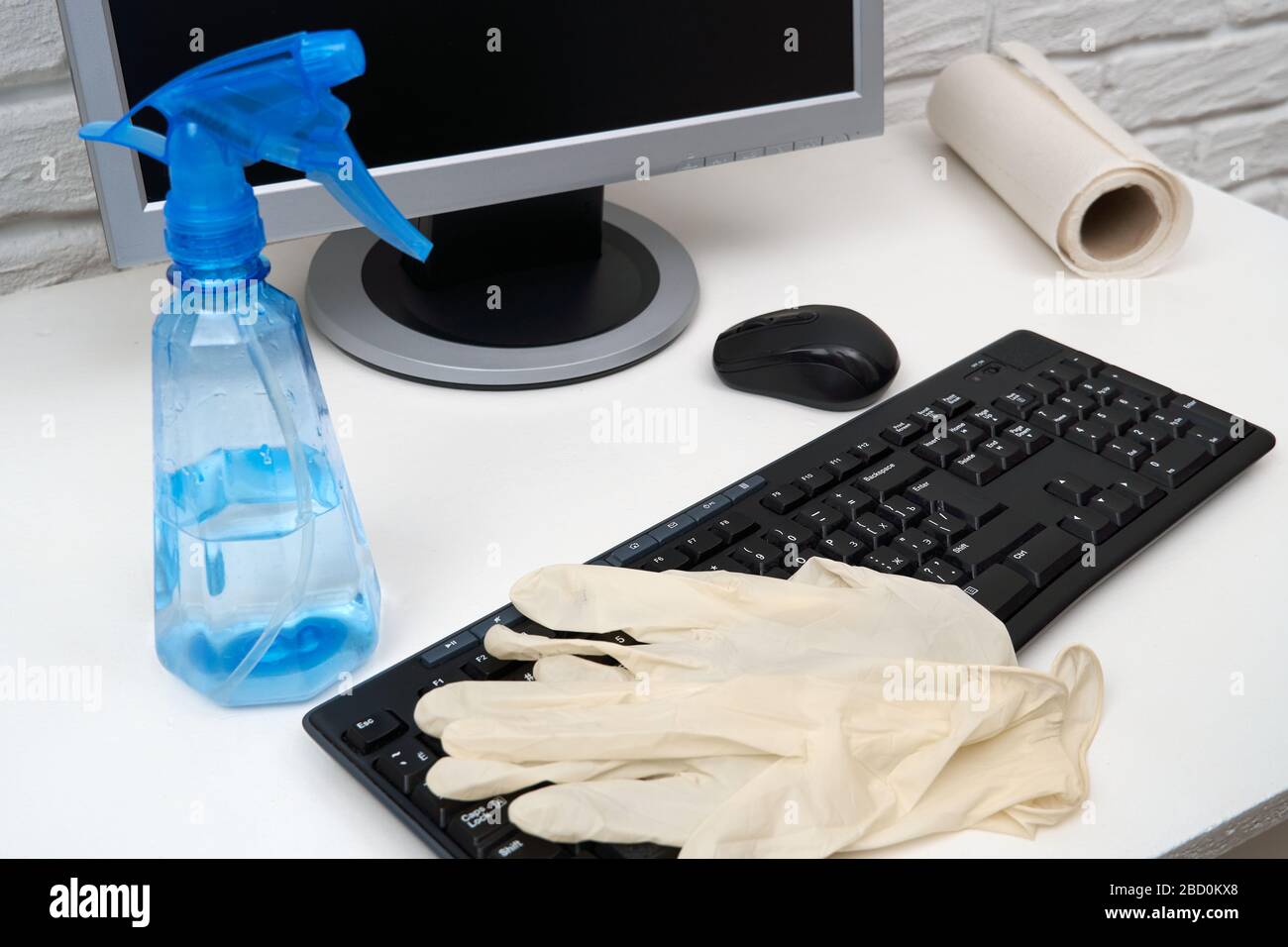concept of cleaning or disinfecting the office - a businessman cleans ...