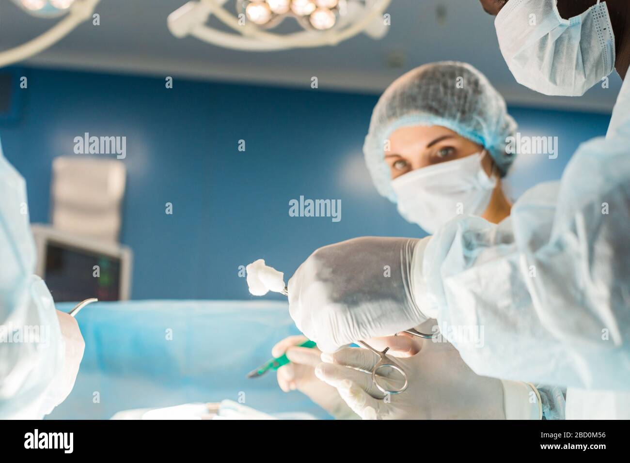 The senior surgeon in the operating room, where the patient is waiting ...