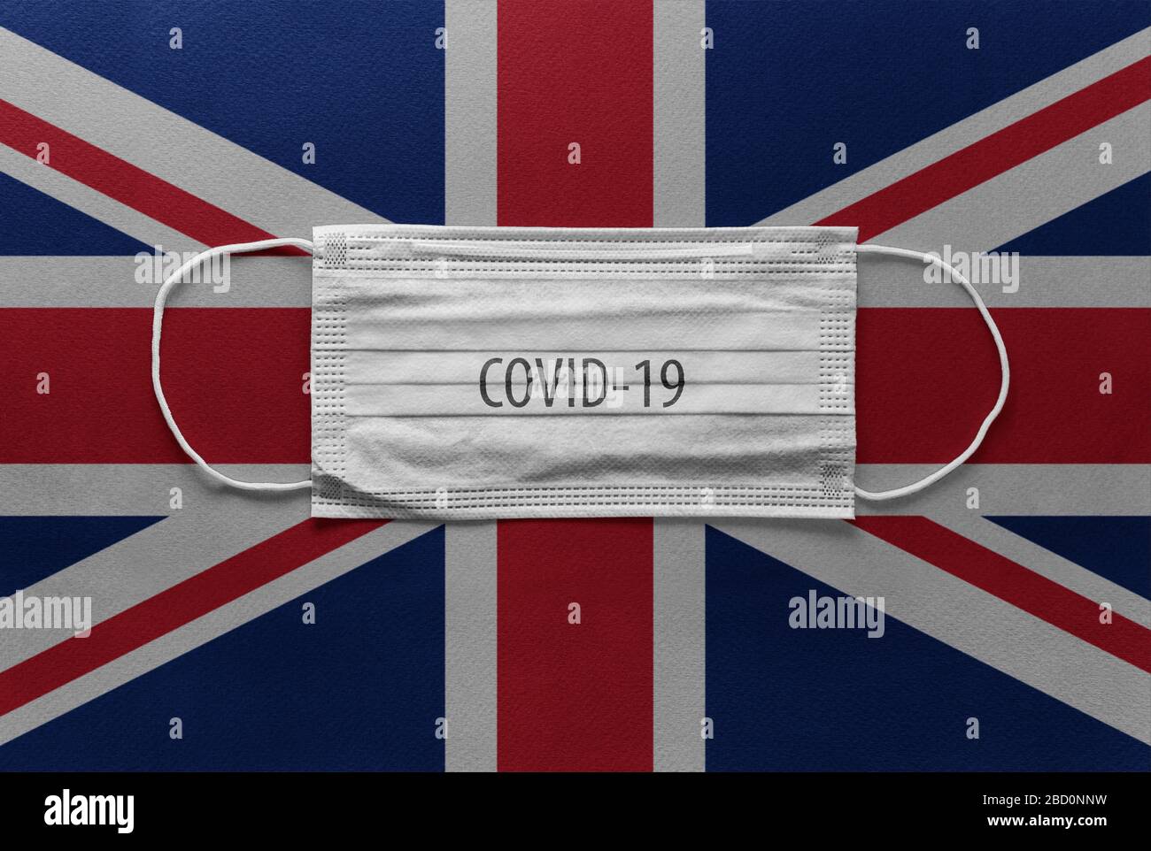 An individual face medical surgical mask on Great Britain flag ...
