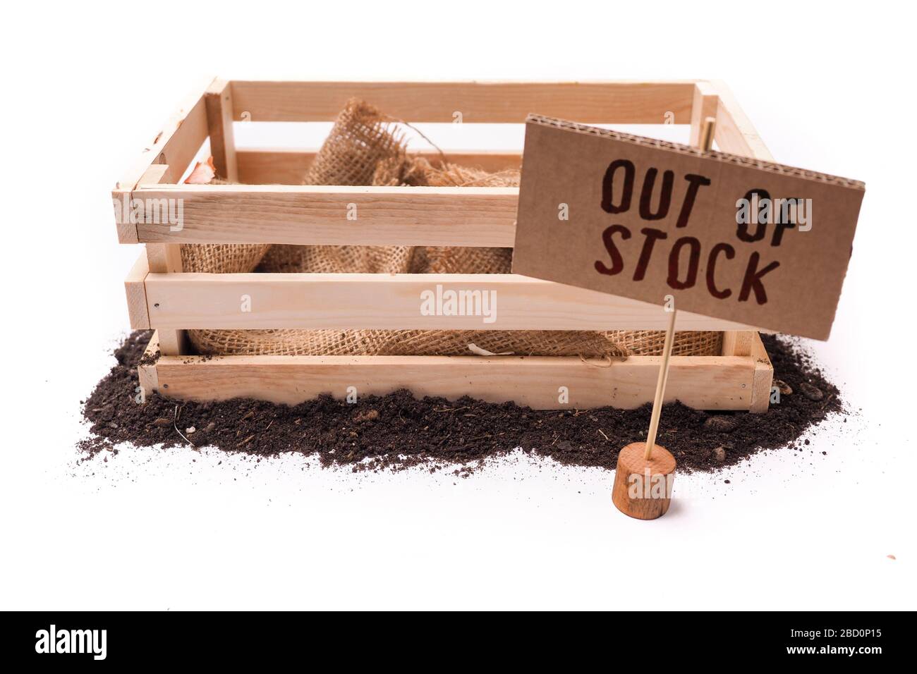Out of stock written label tag and empty box and topsoil with cardboard ...