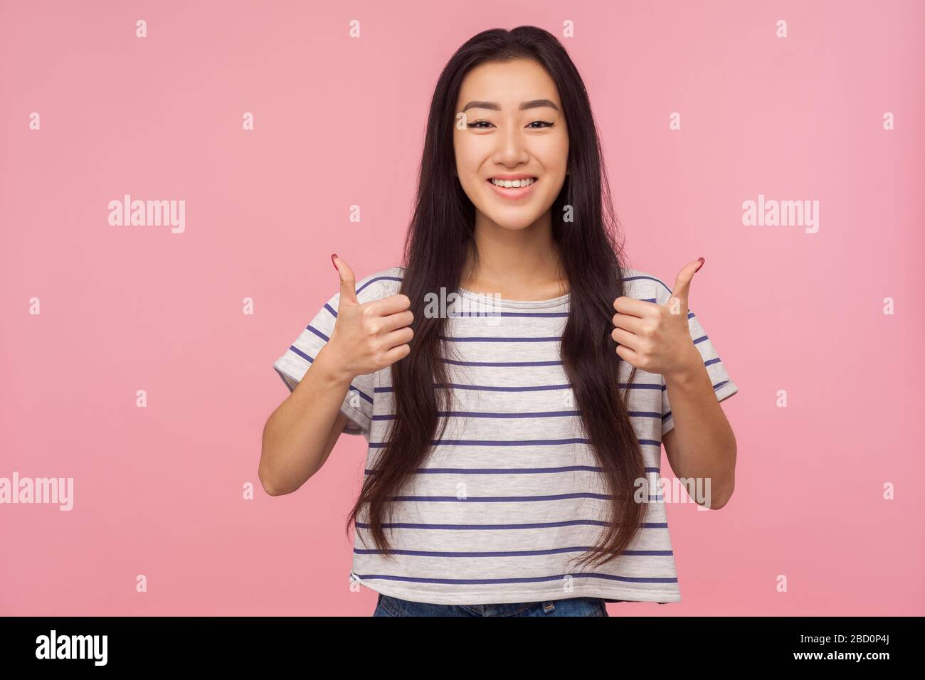Well done, like it! Portrait of glad satisfied girl with long hair in ...