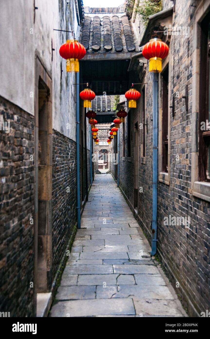 An alleyway between old buildings in the area of Yangzhou’s Dongguan ...