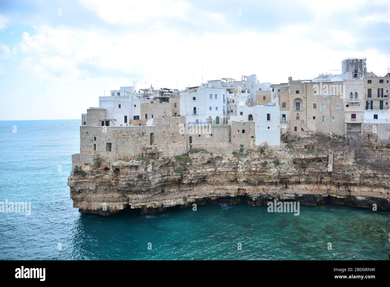 Polignano a Mare, Italy-April 2019: city buildings on the very edge of ...
