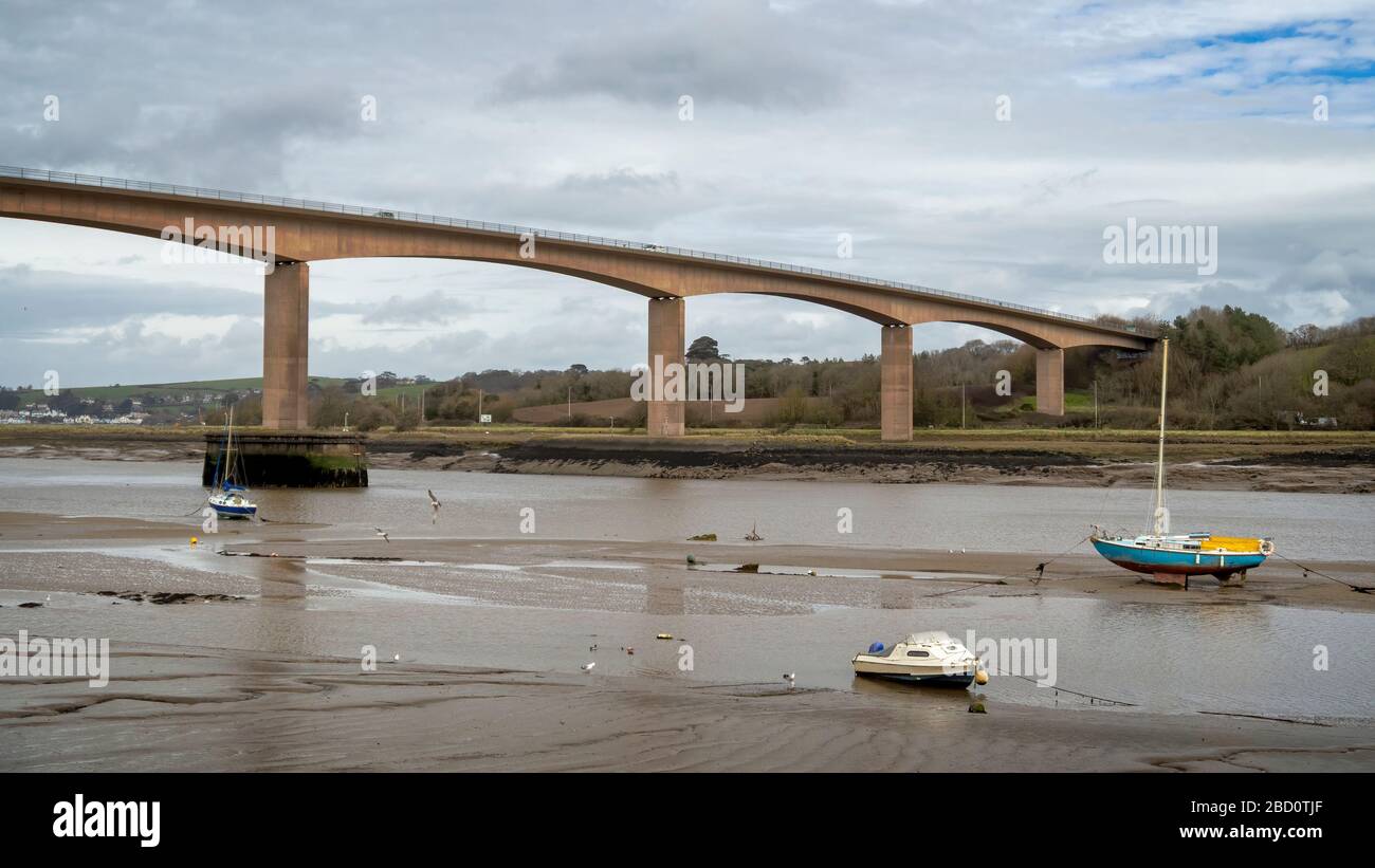 Tide out in Bideford, north Devon, England, UK. View of boats and new bridge. River Torridge ...