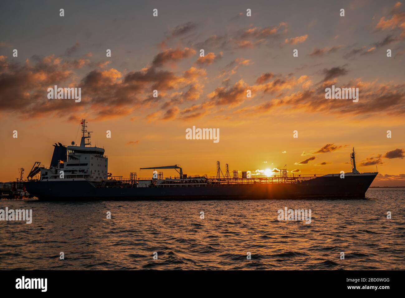 Oil and Gas tanker at sea during sunset, chemical transport vessel ...