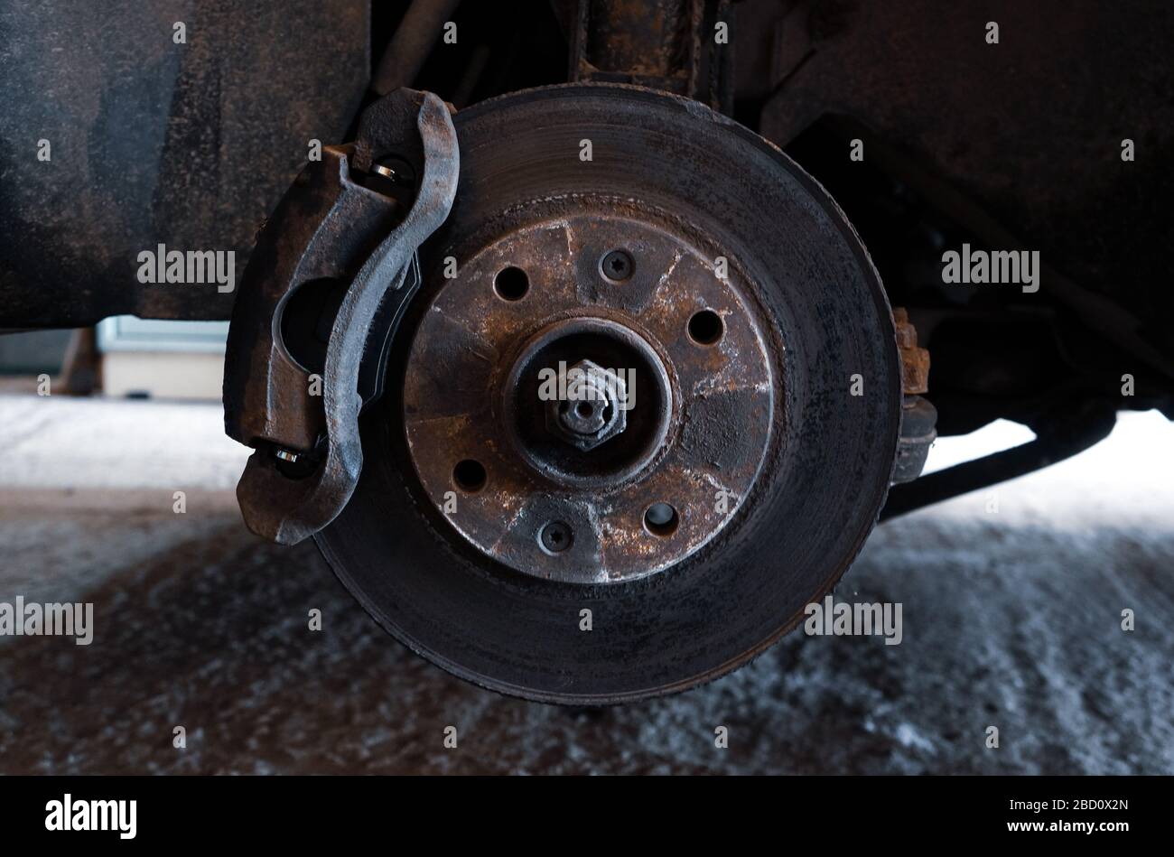 car on a jack without a wheel, brake pad replacement, car repair Stock ...