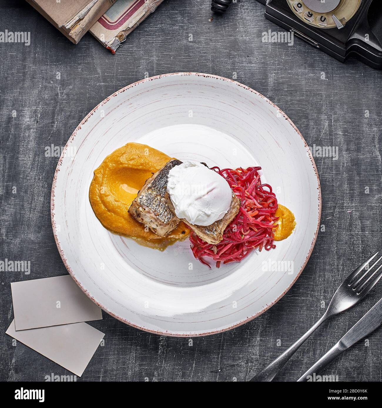 roasted Pike perch with vegetable noodles and egg. Close up, selective ...