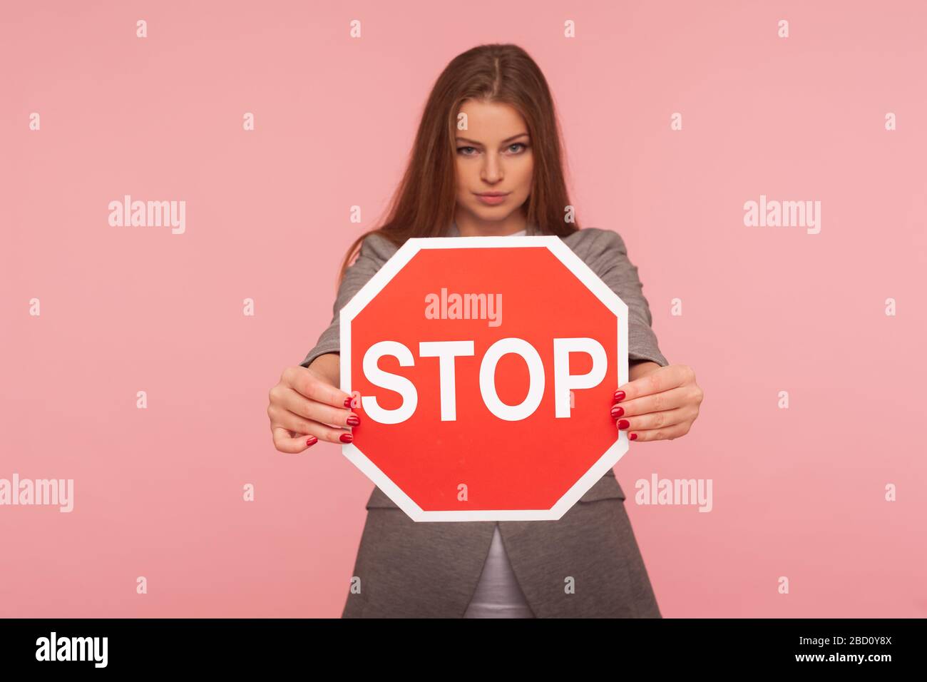 No access, way prohibited! Portrait of bossy brunette woman holding red ...