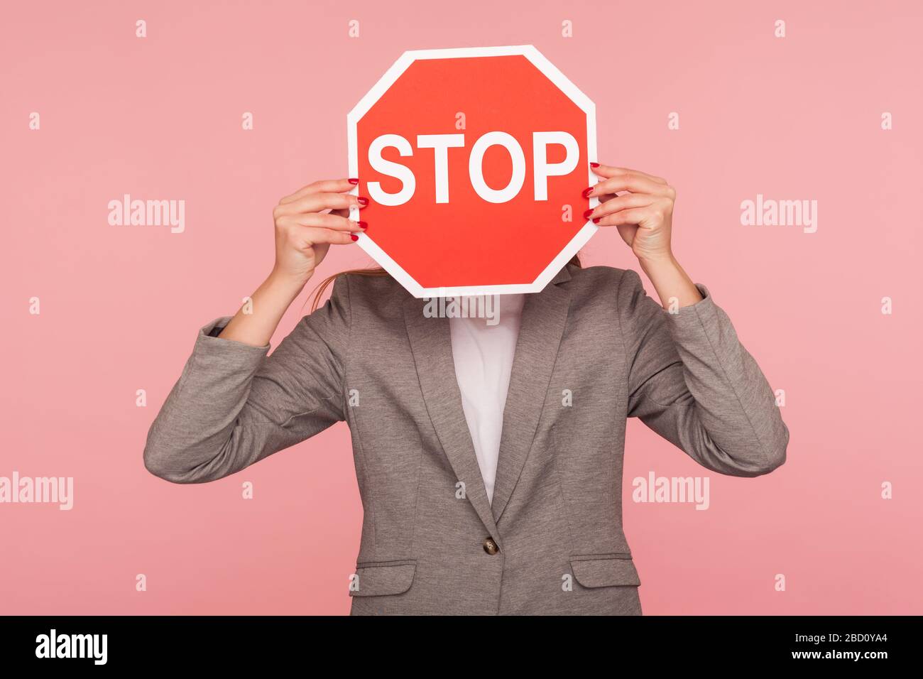 Portrait of unknown business person in suit jacket covering face with ...