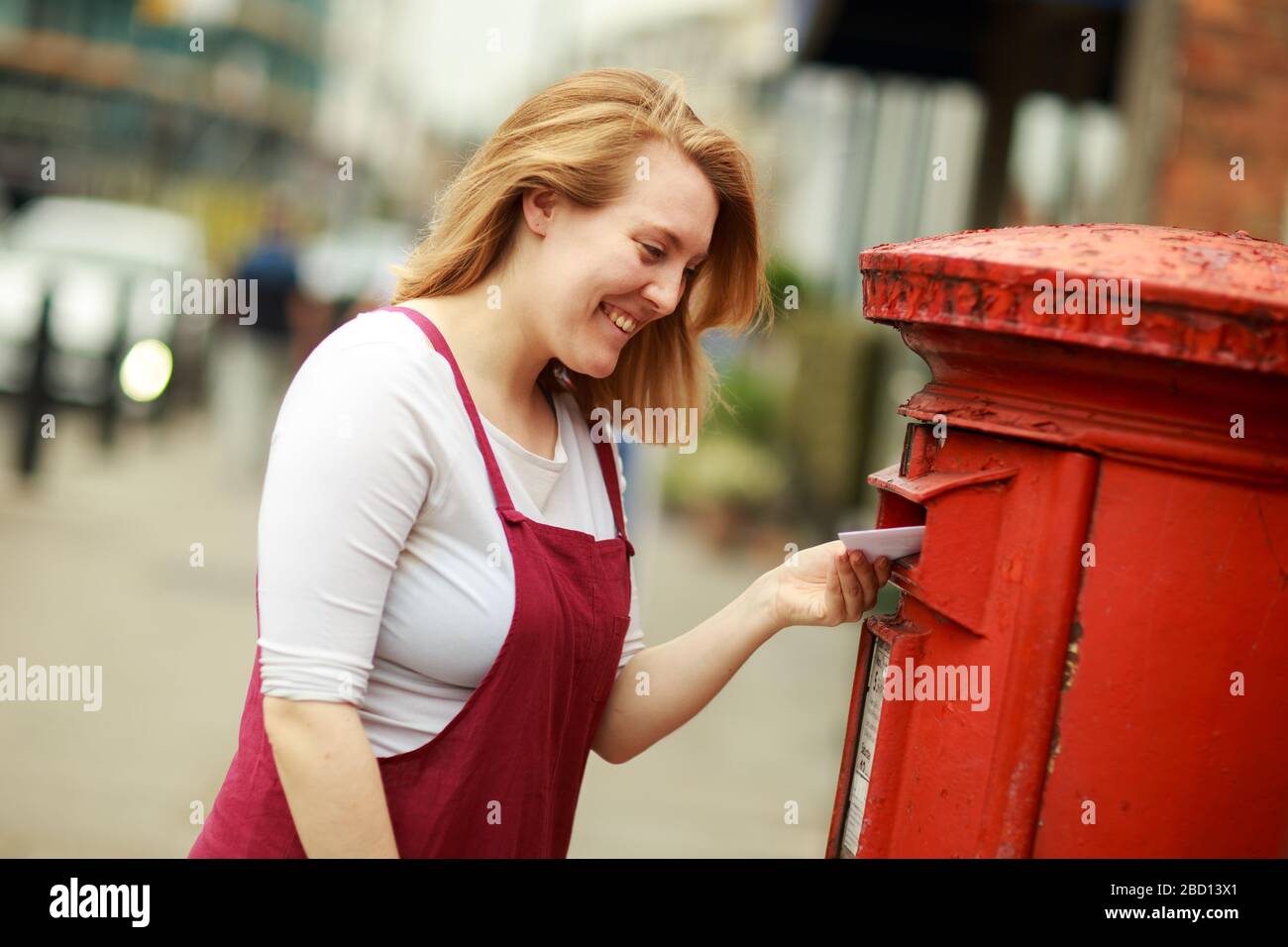 Posting letter uk girl hi-res stock photography and images - Alamy