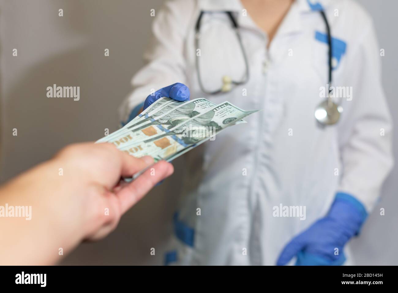 Doctor takes money hi-res stock photography and images - Alamy