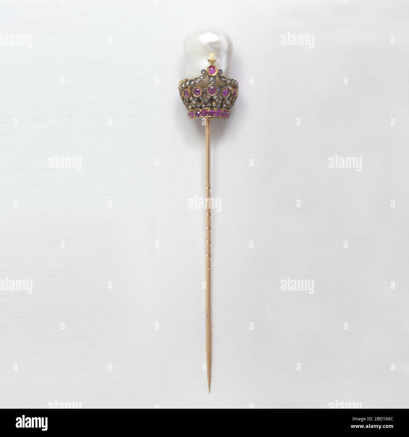 Stick pin. Research in ProgressStraight pin surmounted by jeweled crown ...