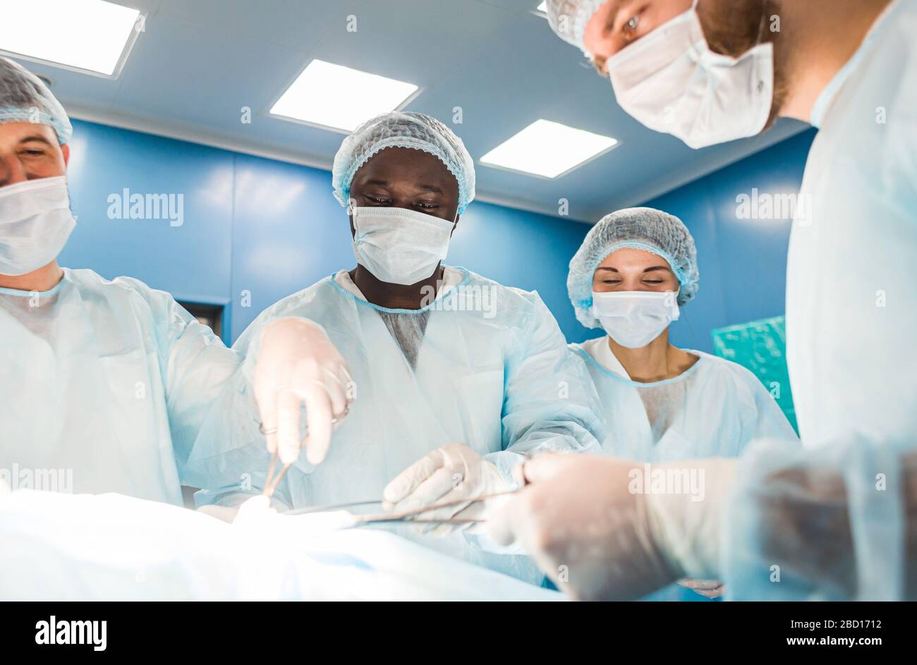 The senior surgeon in the operating room, where the patient is waiting ...