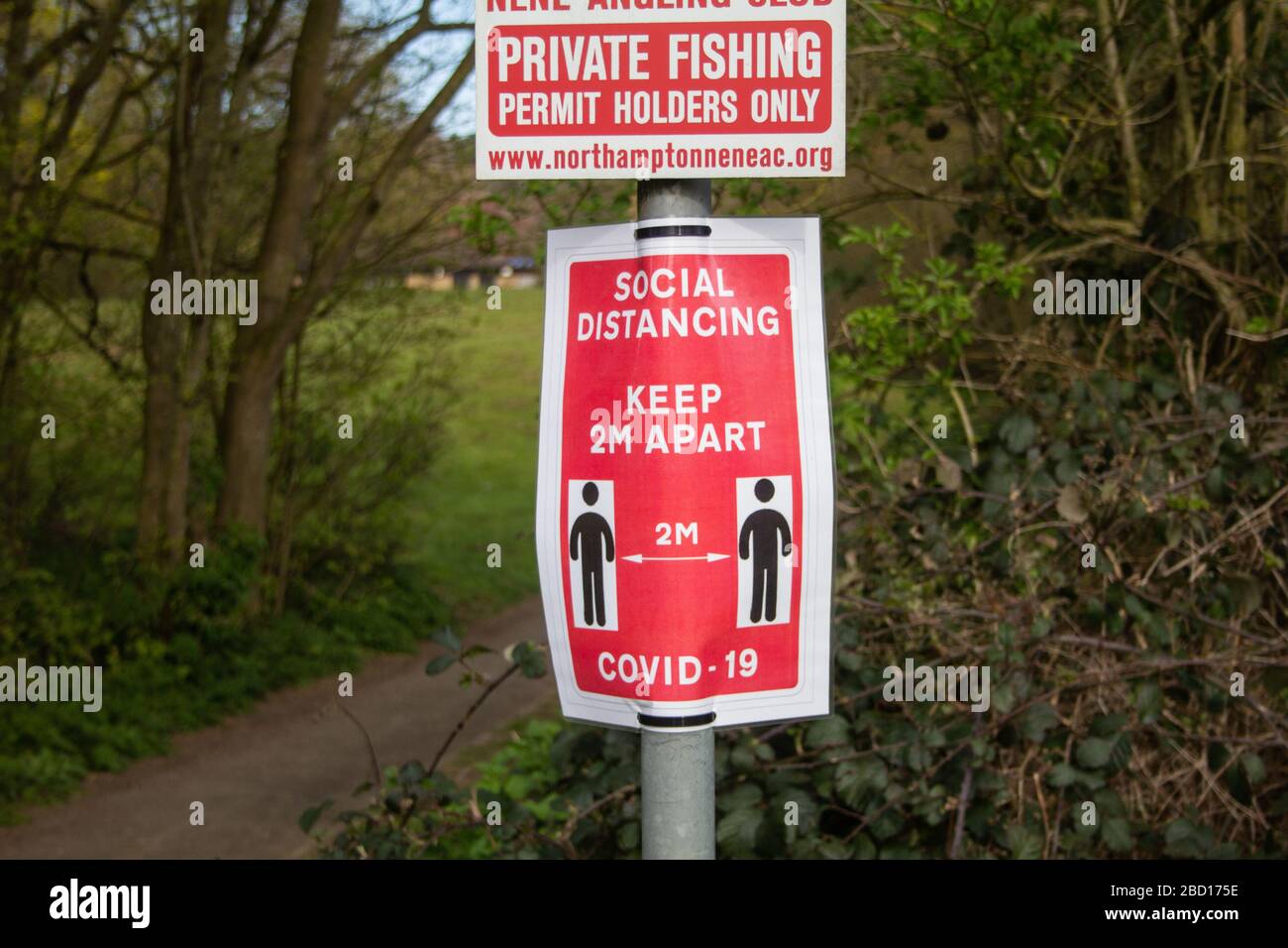 Signs reminding the public to obey social distancing rules when in ...