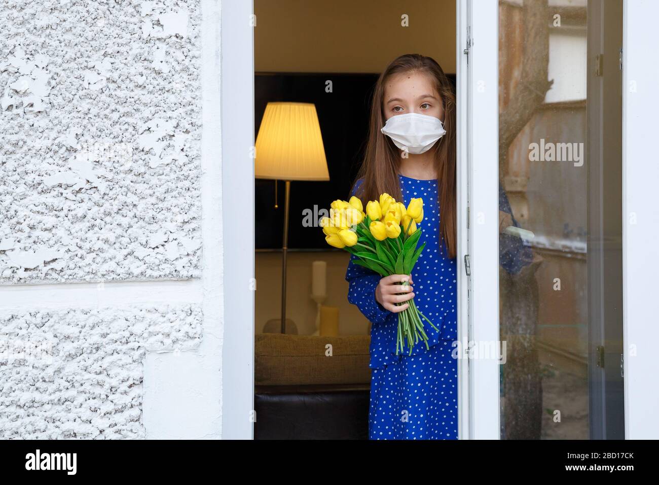 Self-isolated young girl looking out Stock Photo - Alamy