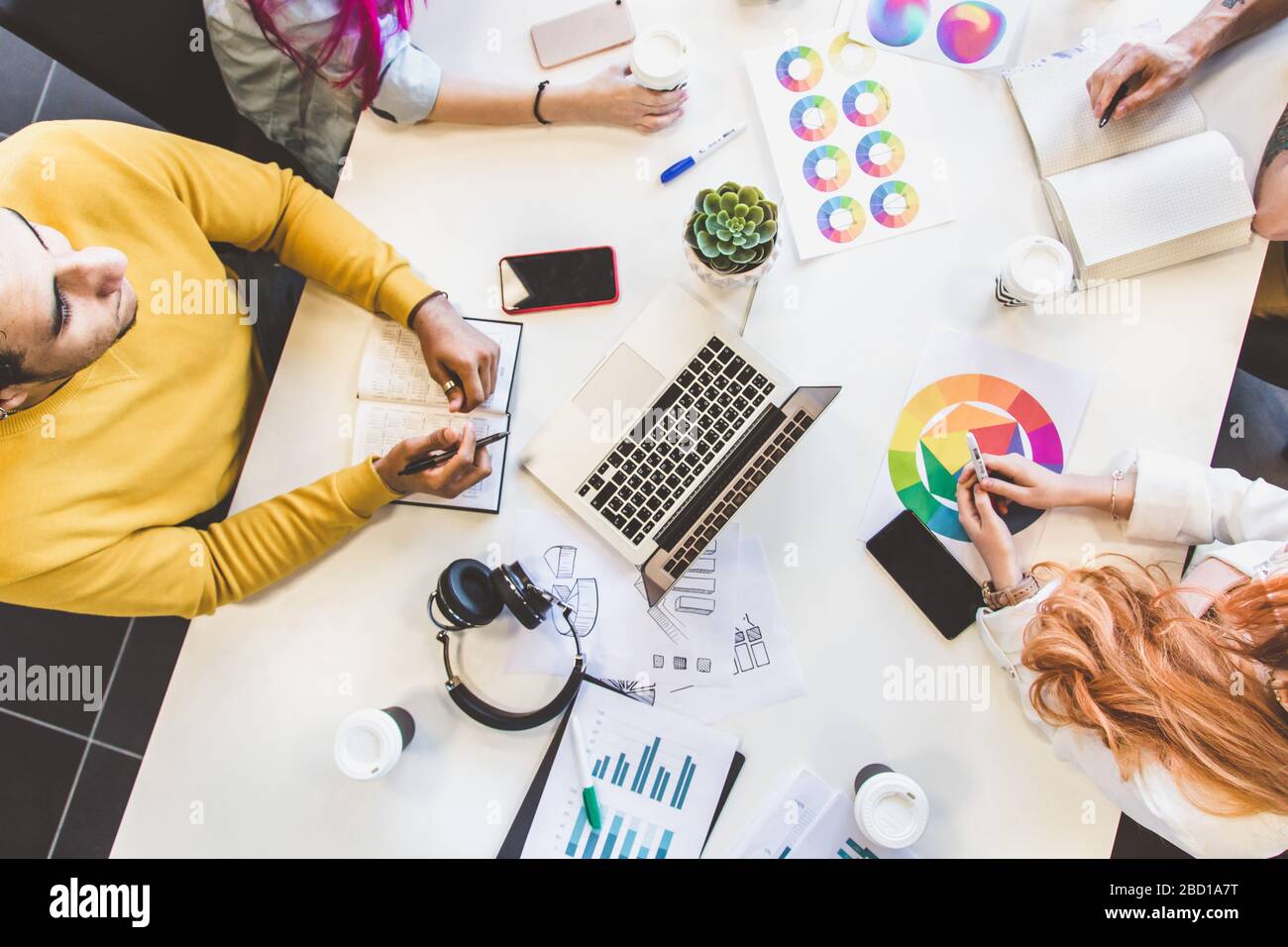 Executives Brainstorming Around A Table High Resolution Stock ...