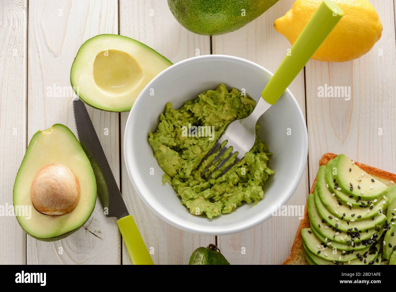 Bowl of mashed avocado with a fork Stock Photo - Alamy