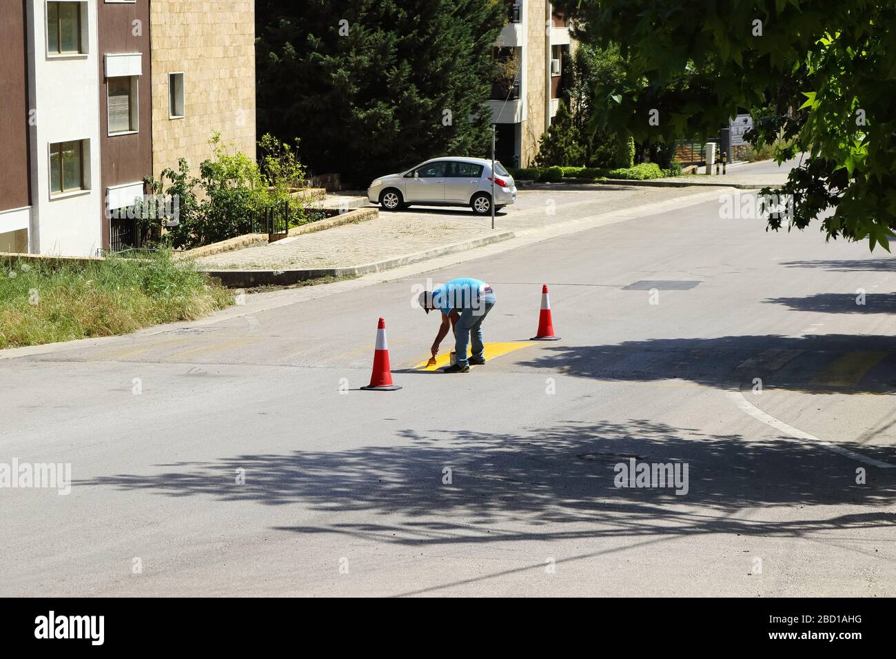 Broumana, Lebanon - May 08, 2017: Unknown labour painting on the street ...