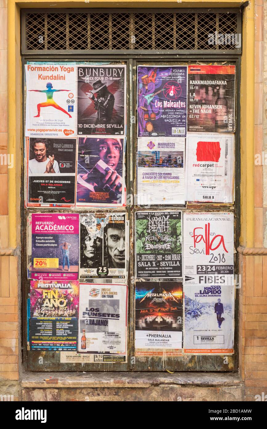 Old music event and concert posters stuck on a wall in Seville Spain ...