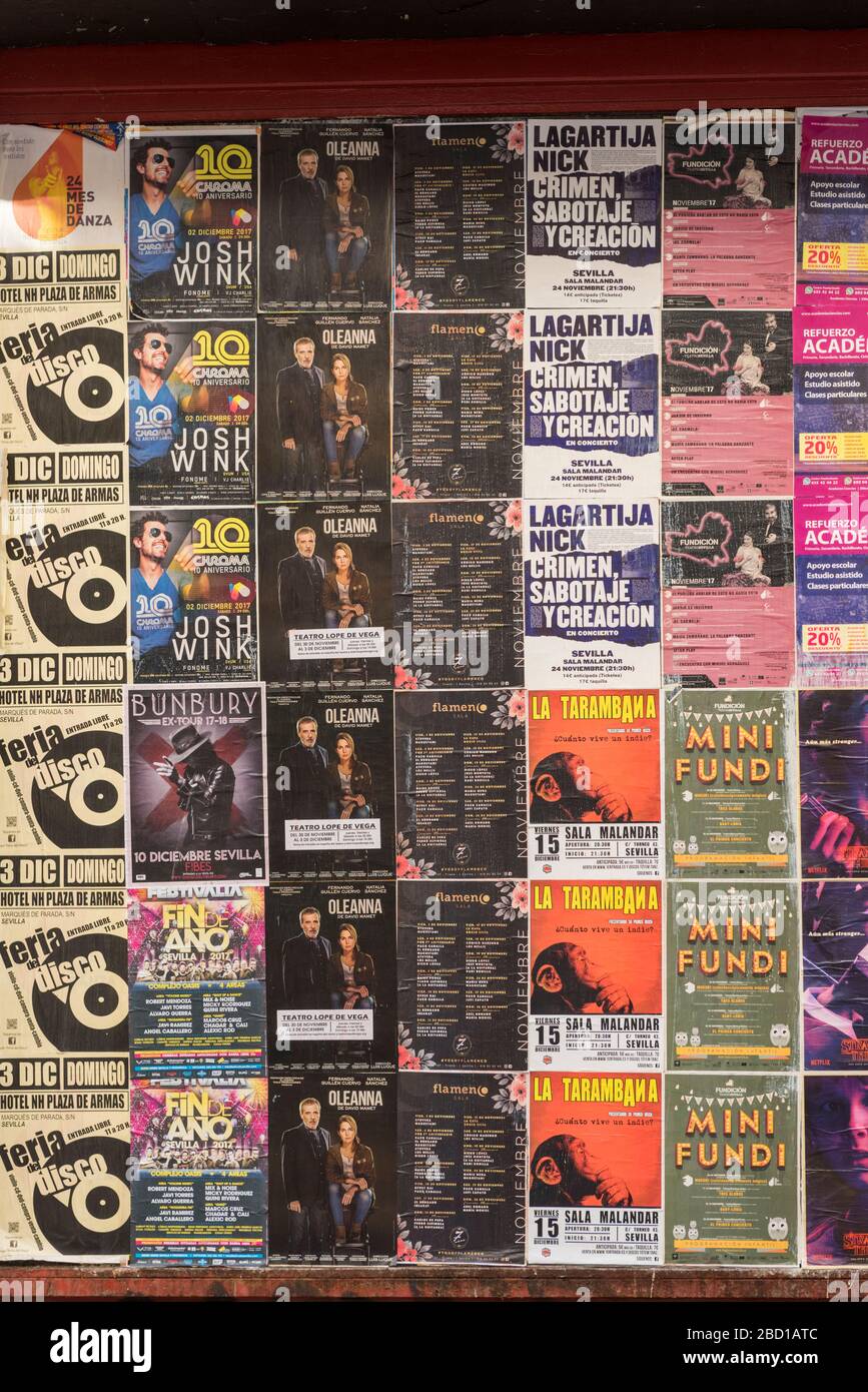 Old music event and concert posters stuck on a wall in Seville Spain ...