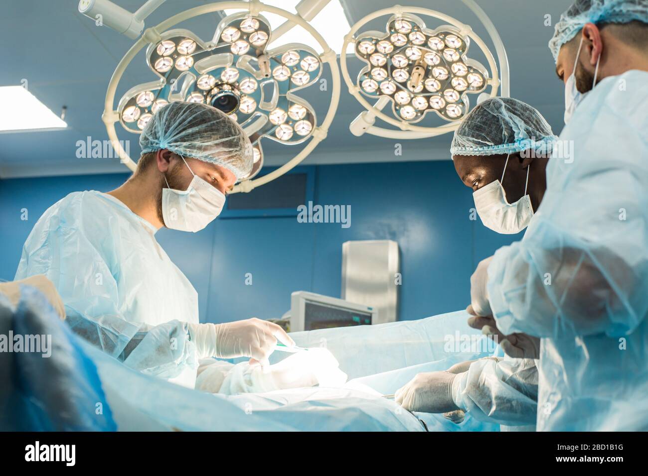 The senior surgeon in the operating room, where the patient is waiting ...