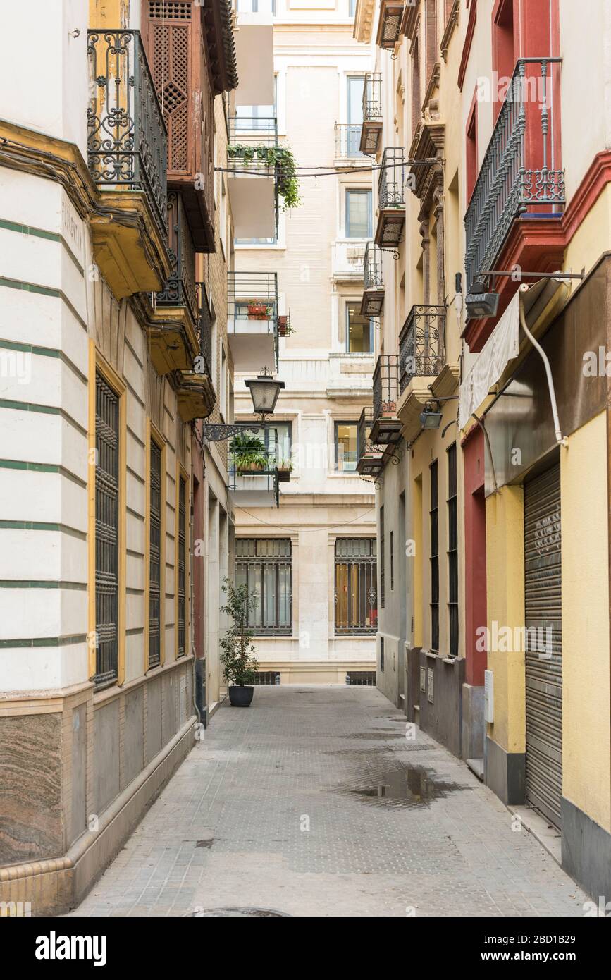 An empty narrow street showing the buildings in the city centre of ...