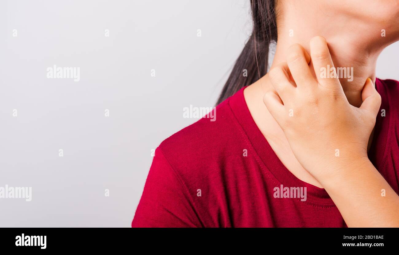 Asian beautiful woman itching her scratching her itchy neck on white ...