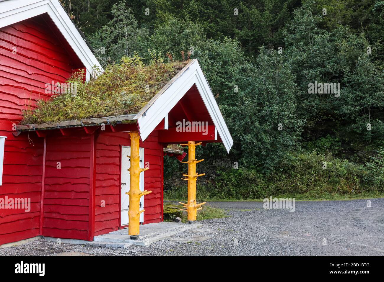 Red wooden traditional scandinavian green grass roof hut house in ...