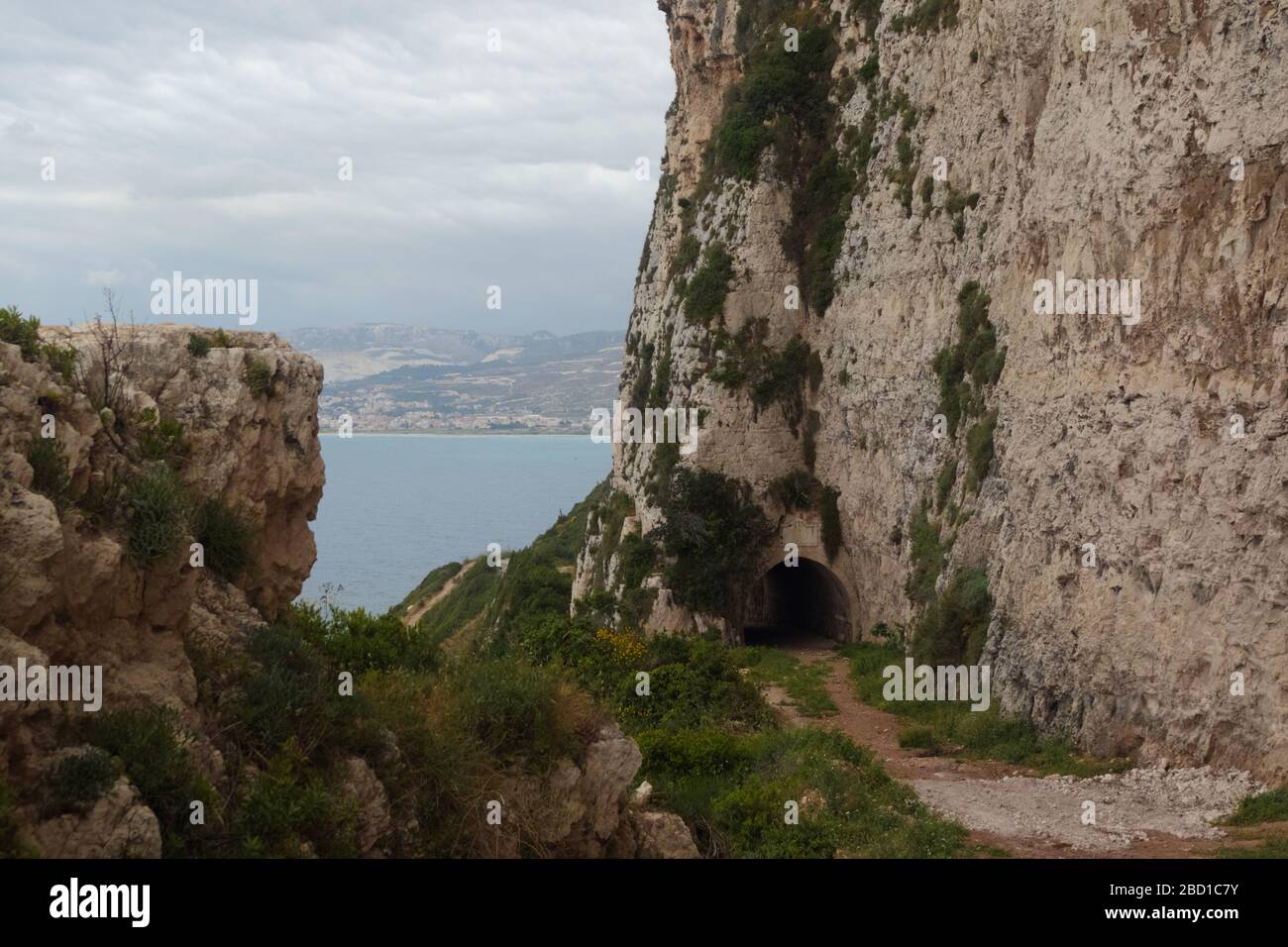 View of tunnel in the cliff at Chekka, Lebanon Stock Photo - Alamy