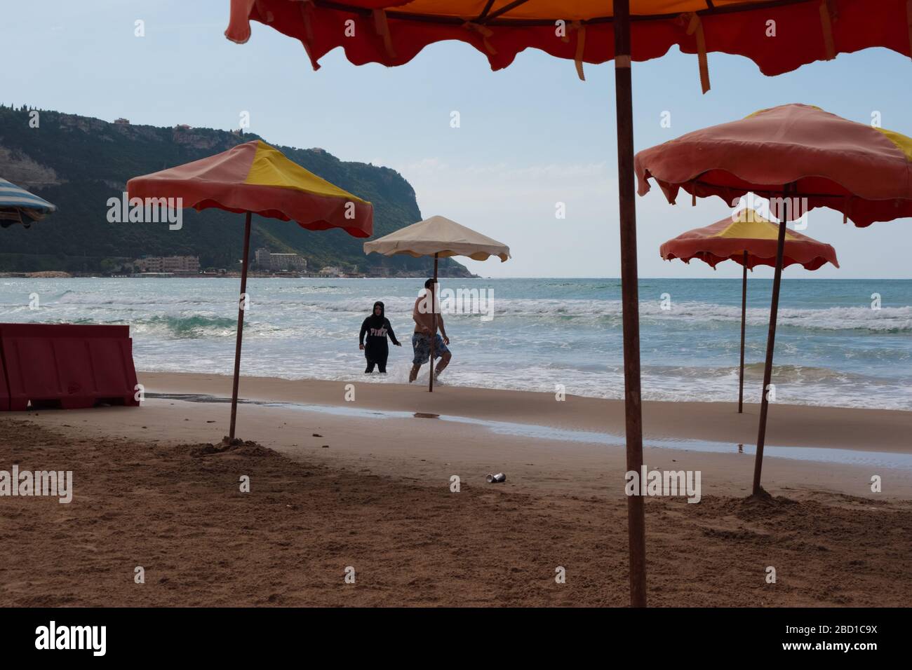 Chekka, Lebanon - May 19, 2017: Couples enjoy dipping in the sea waters ...
