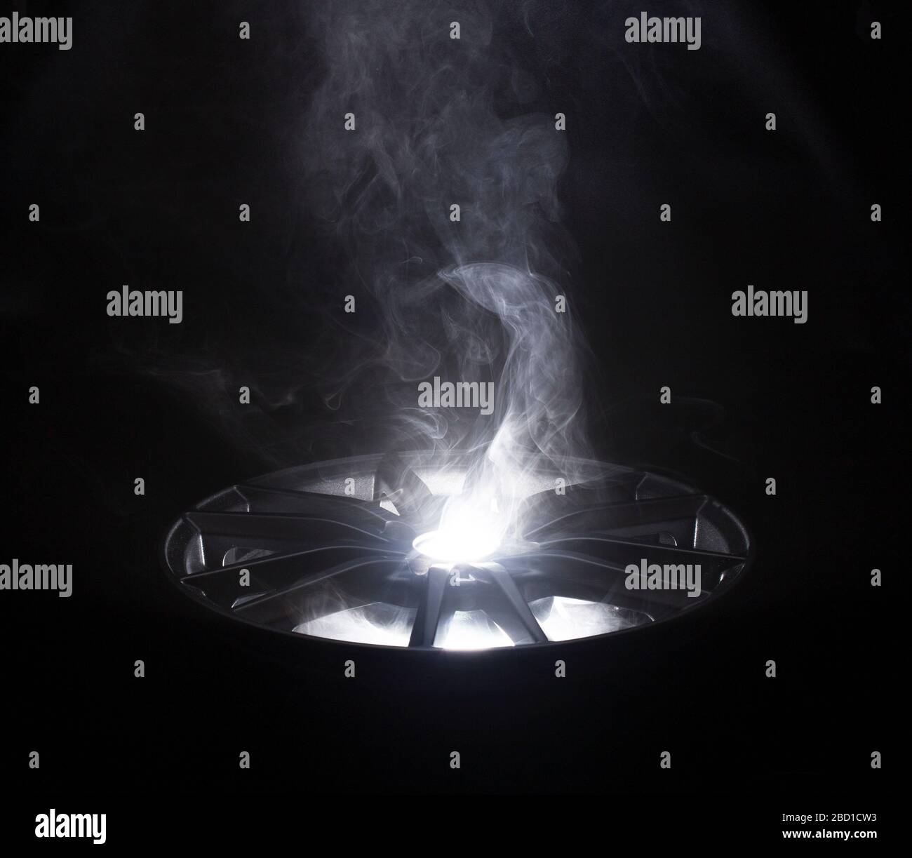 A modern beautiful automotive alloy wheel in the form of rays that is ...