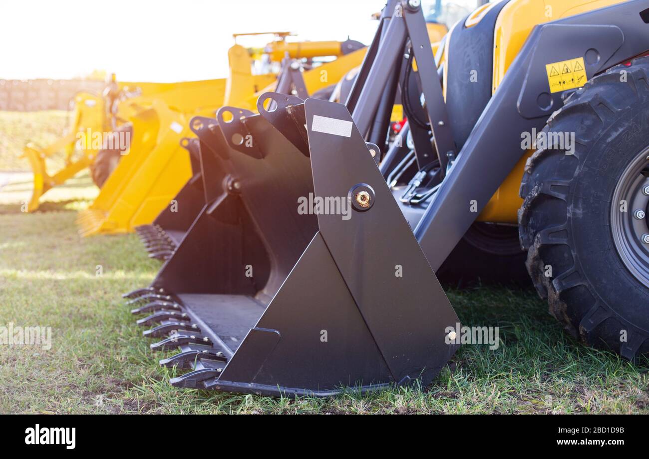 New construction equipment, wheel loaders with bucket for loading sand ...