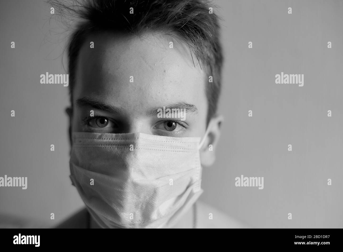 self-isolation and quarantine, portrait of a teenage boy in a medical ...
