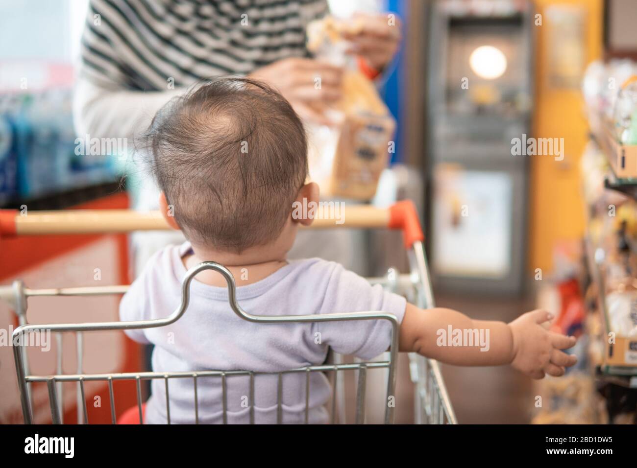 Pushing baby in shopping trolley hi-res stock photography and images ...